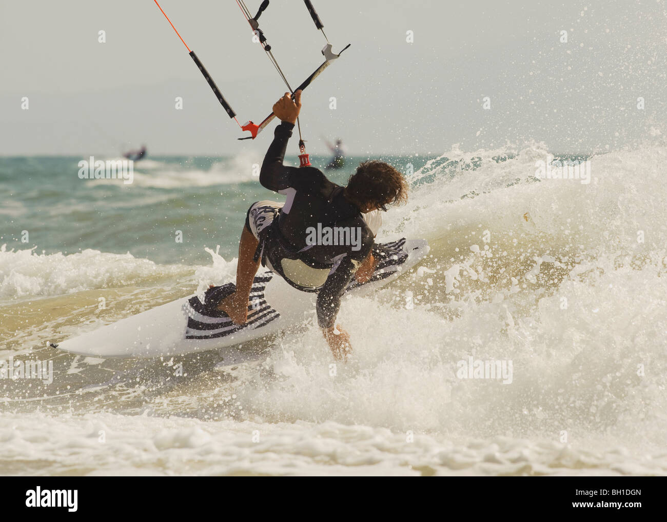 Surfers catching wave hi-res stock photography and images - Alamy