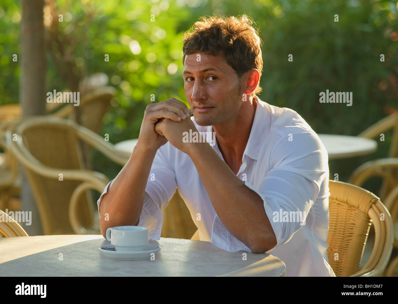 Man drinking coffee outdoors Stock Photo - Alamy