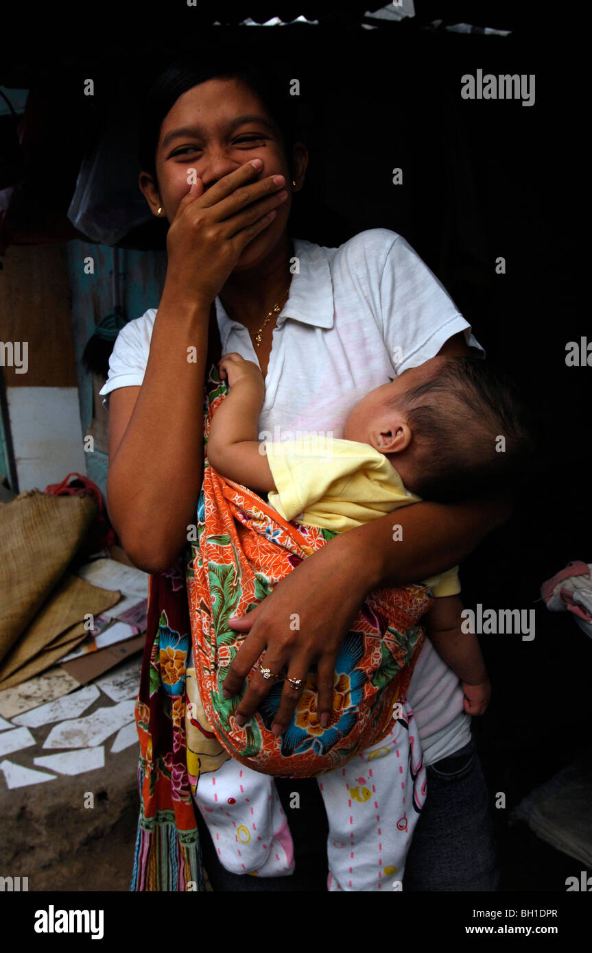 Shy mother and her little girl in slum, Bali,Indonesia Stock Photo - Alamy
