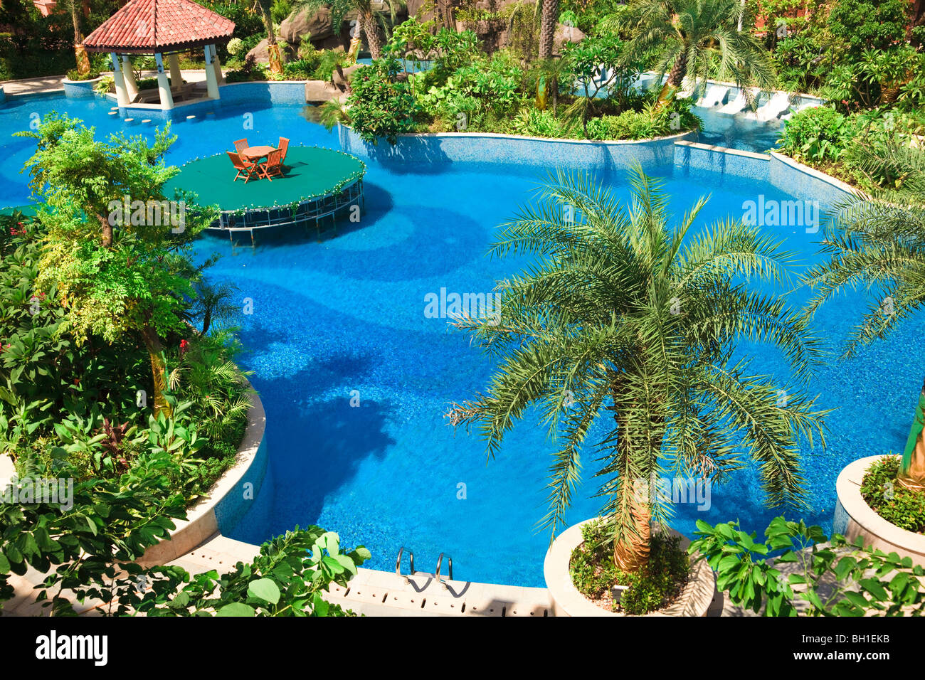 Central resting platform with table and chairs in a water park Stock ...