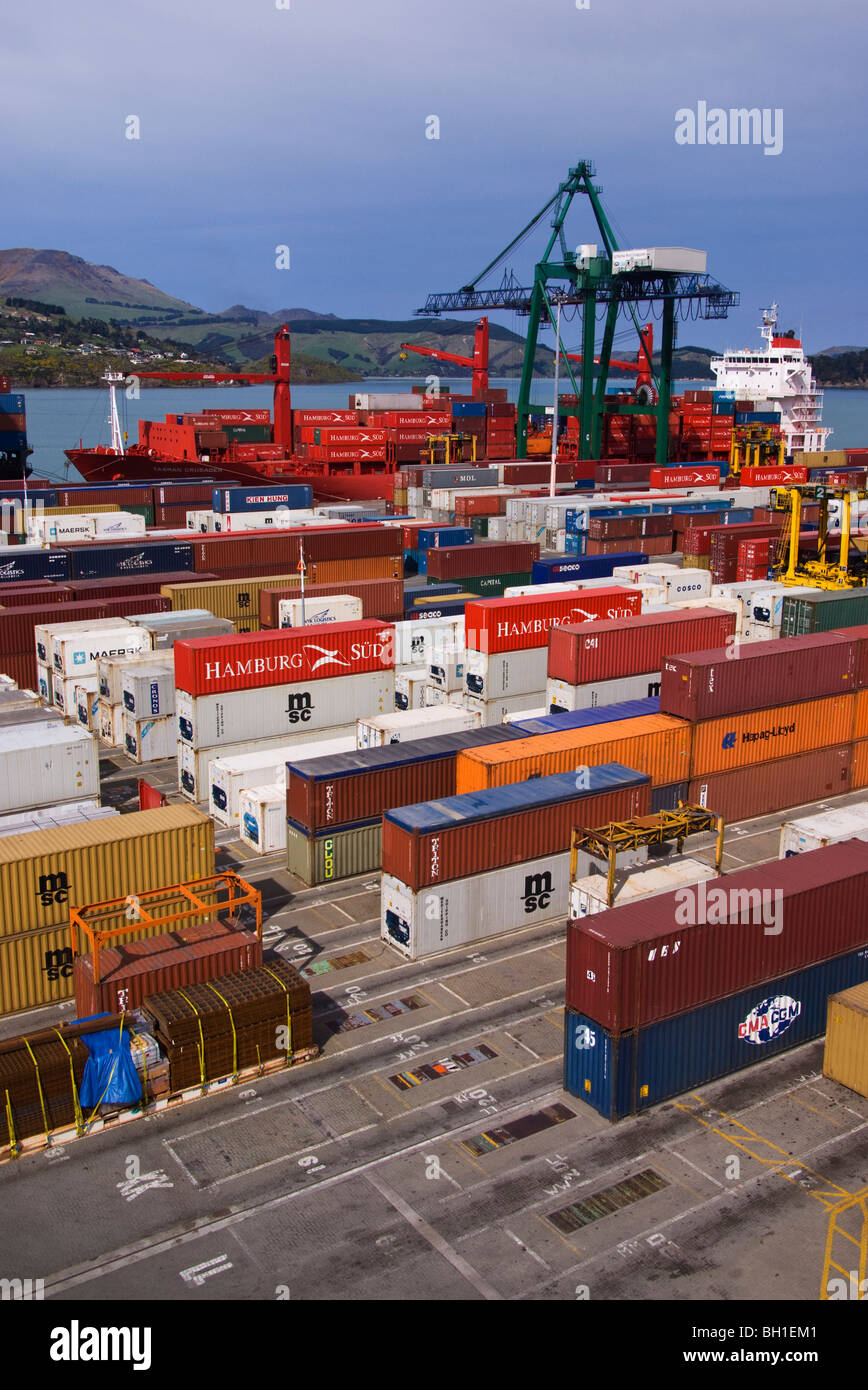 A container terminal with a ship alongside the quay loading and ...