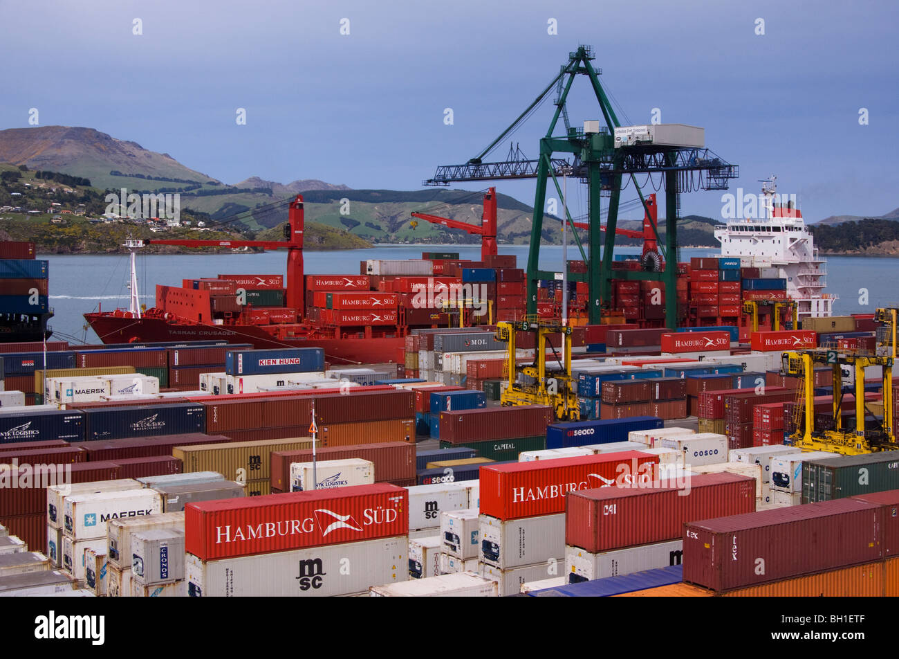 A container terminal with a ship alongside the quay loading and ...