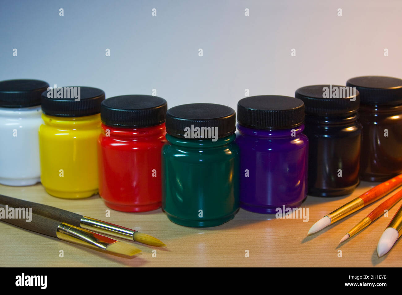 Jars of Paint and Paintbrushes Stock Photo - Alamy