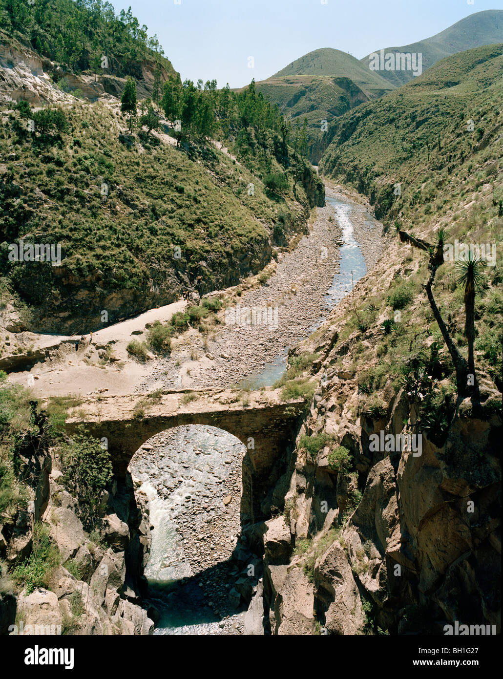 View at decayed stone bridge above Rio Apulco, Puebla province, Mexico ...