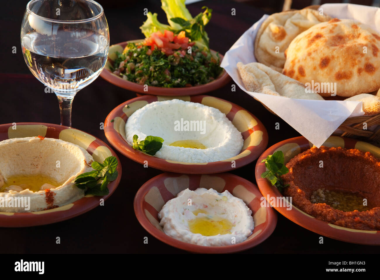 Mezze, bowls filled with appetizers and bread, Hilltop restaurant ...