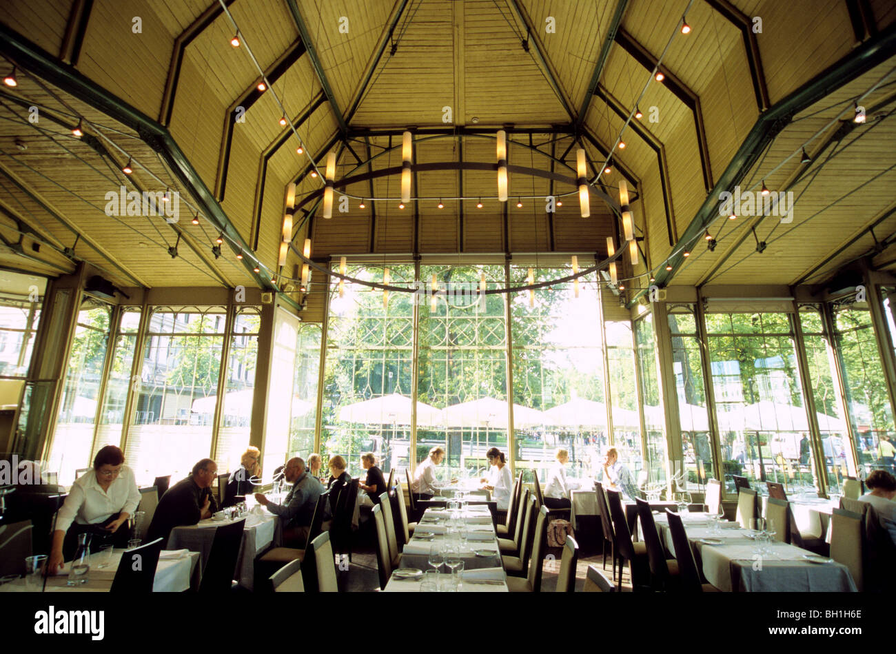 People sitting at Cafe Kappeli at the Esplanade, Helsinki, Finland ...