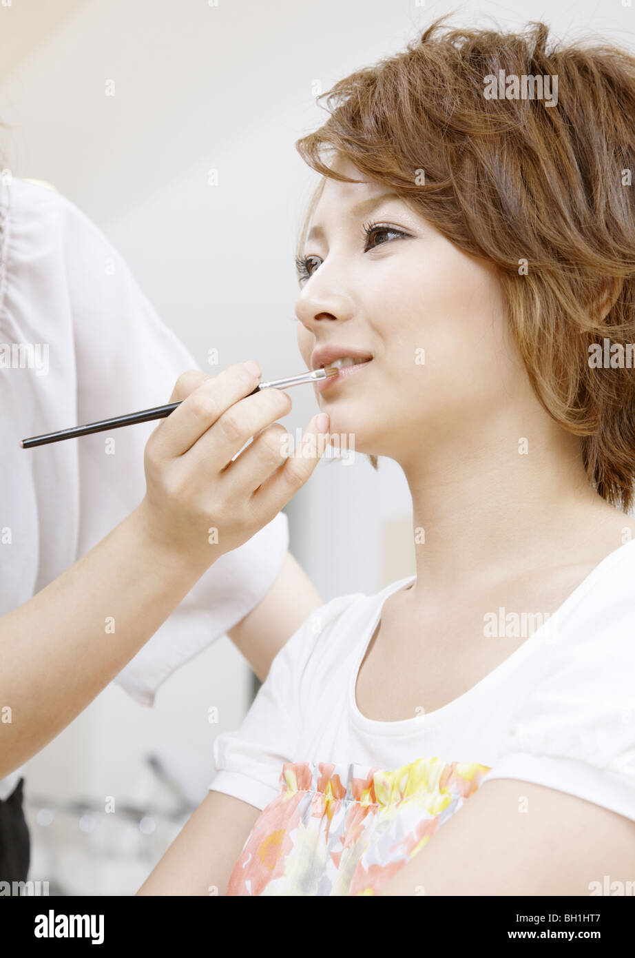A young woman getting her makeup done Stock Photo - Alamy