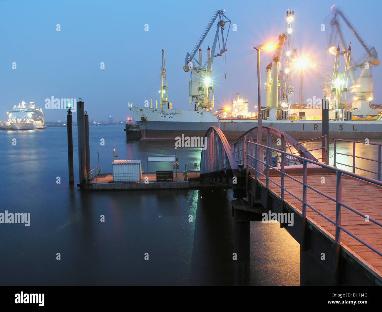 Freedom of the Seas and cargo ship in harbor, Hamburg, Germany Stock ...