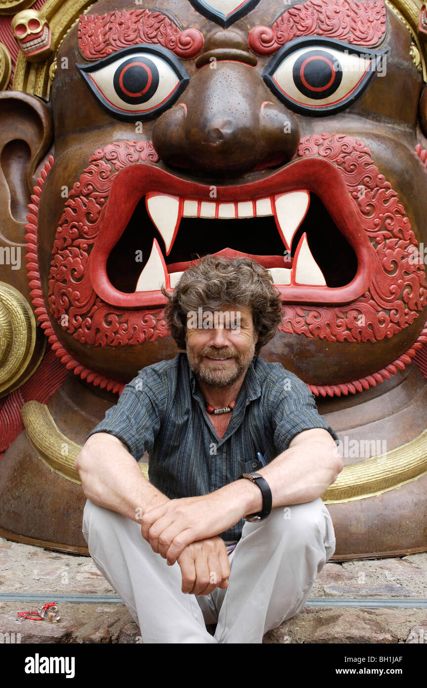 Reinhold Messner sitting in front of a sculpture, Extreme Mountaineer ...