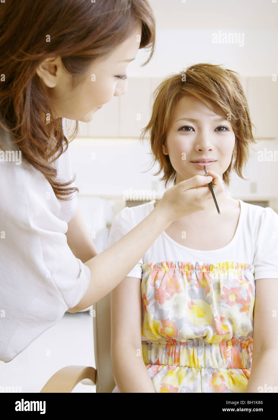 A young woman getting her makeup done Stock Photo - Alamy
