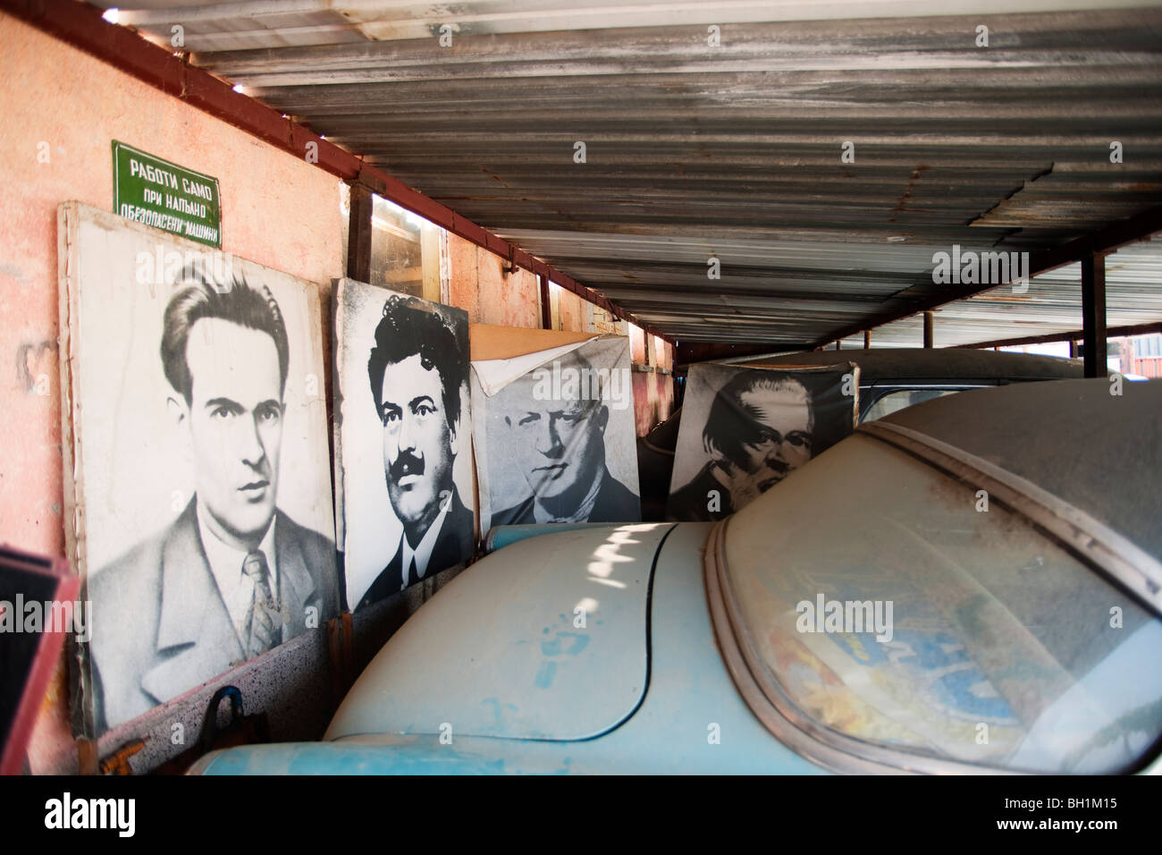 old car stored in garage with old Soviet Political posters Stock Photo ...