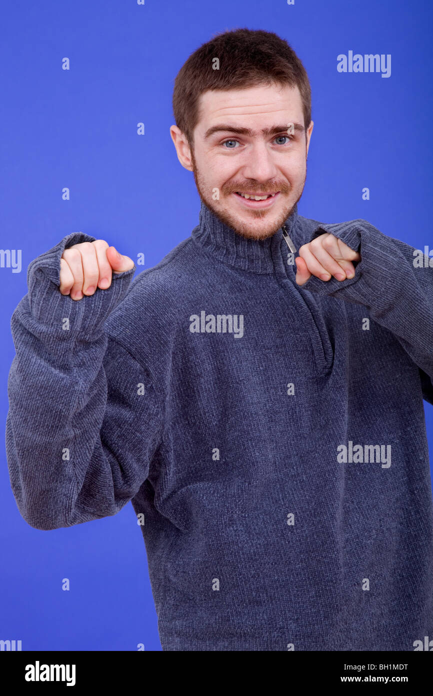an young man portrait over a blue background Stock Photo - Alamy