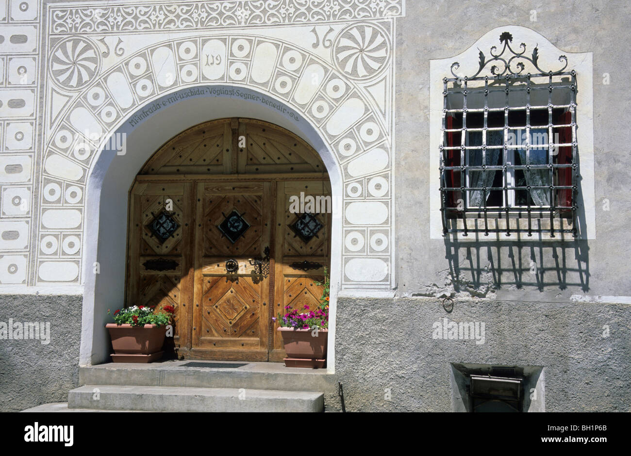 Detail at typical house Engadiner Haus with paintings sgraffiti around ...