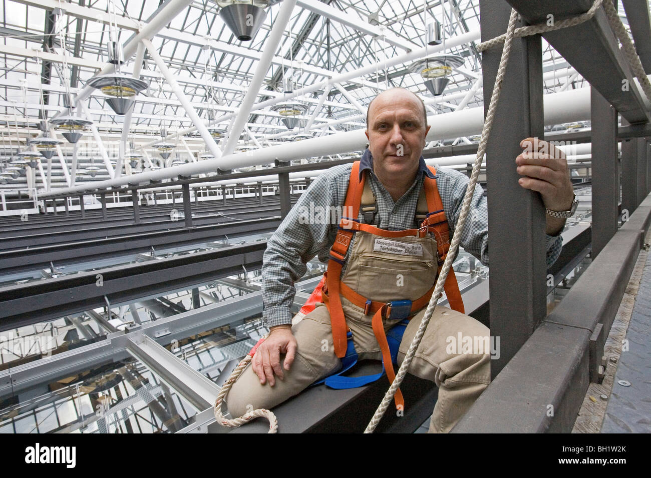 industrial climber, under a steel roof structure, Berlin, Germany Stock ...