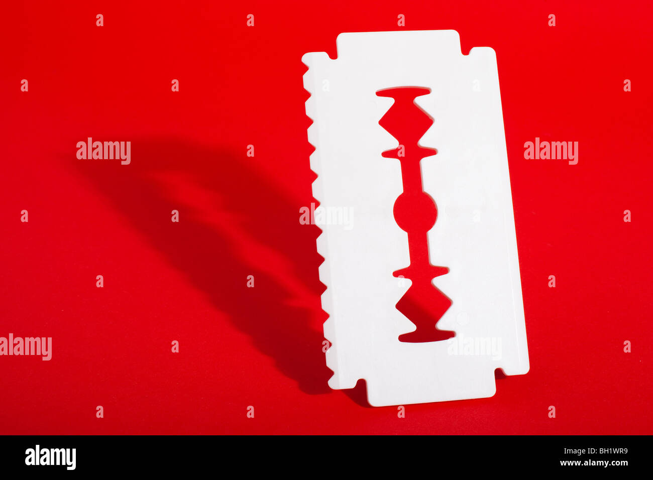 Big white ice scraper shaped as razor blade with hard shadows Stock ...