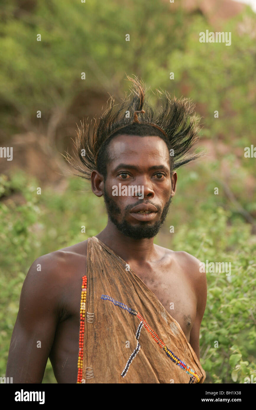 Africa, Tanzania, Lake Eyasi, portrait of a young Hadza male. A small ...