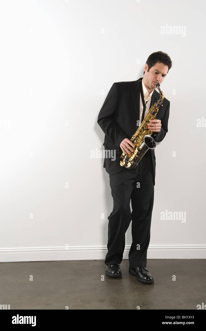 Man playing saxophone white background hi-res stock photography and ...