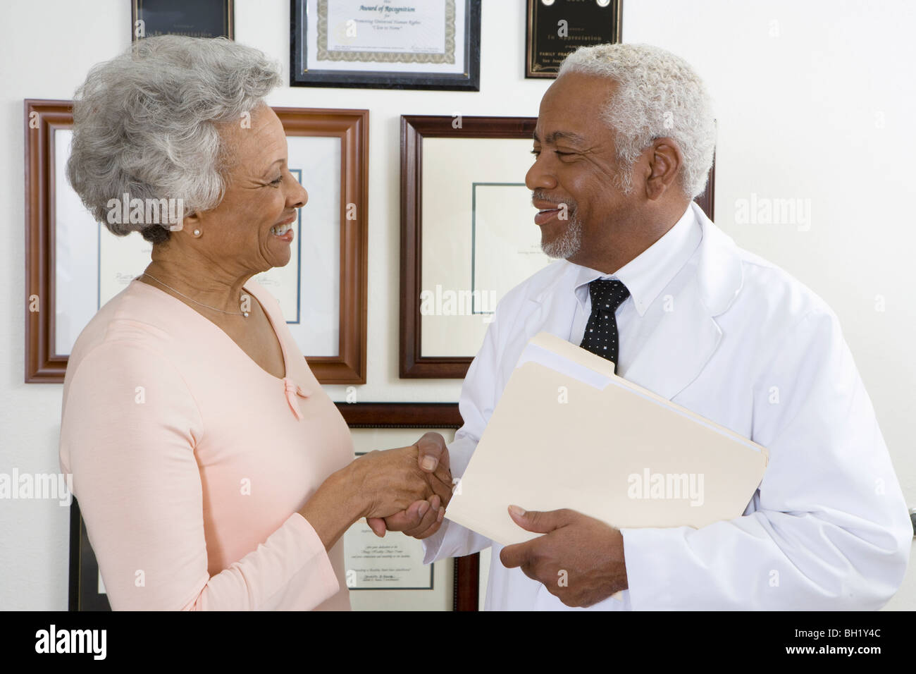 Senior medical practitioner and client Stock Photo - Alamy