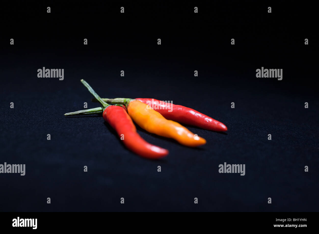 Three chilli peppers Stock Photo - Alamy