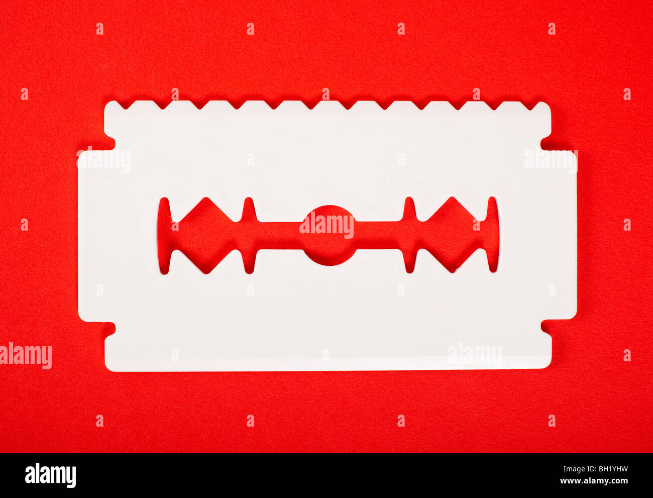 Big white ice scraper shaped as razor blade with one sharp edge and one ...