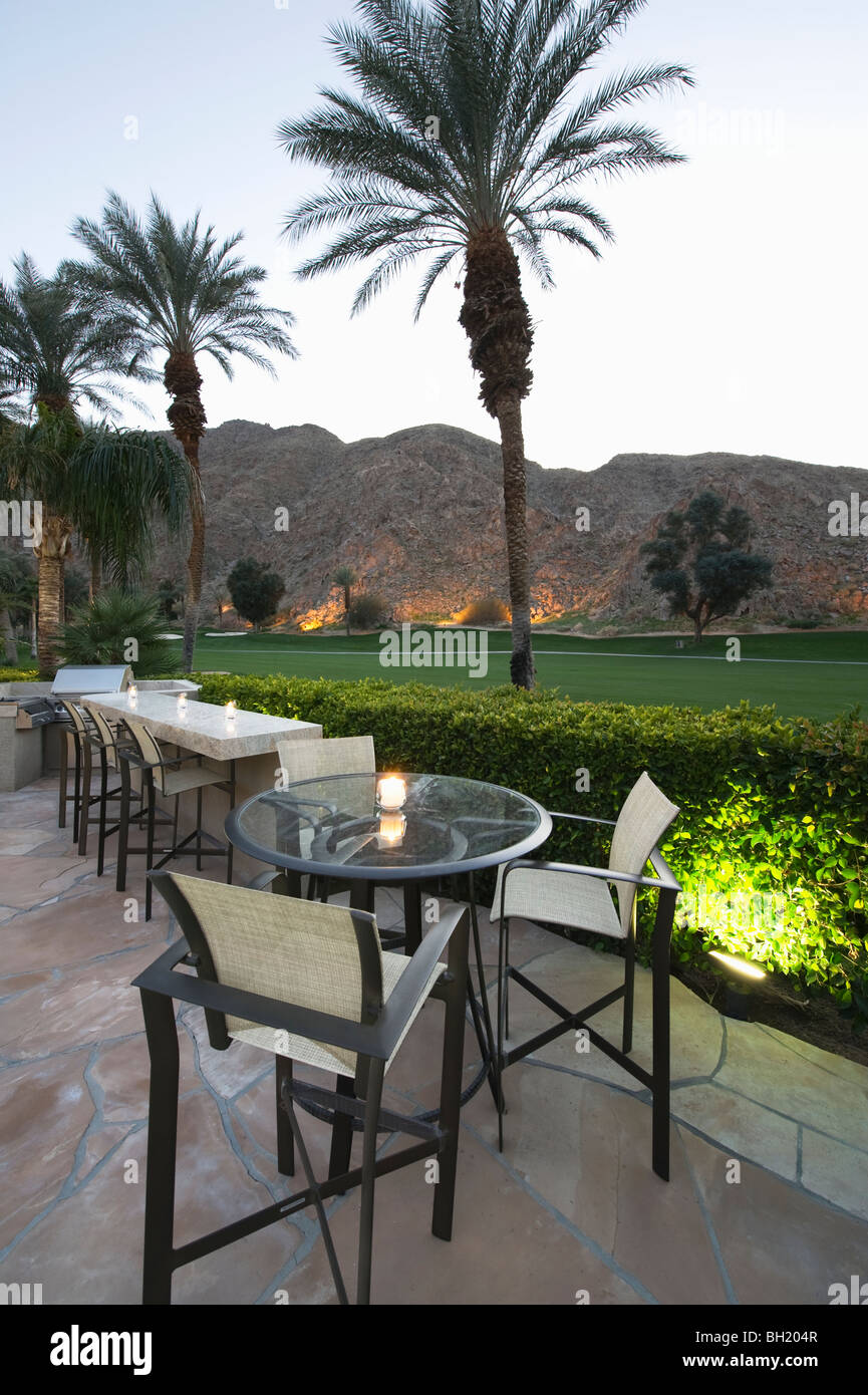 Patio chairs and tables in Palm Springs Stock Photo - Alamy