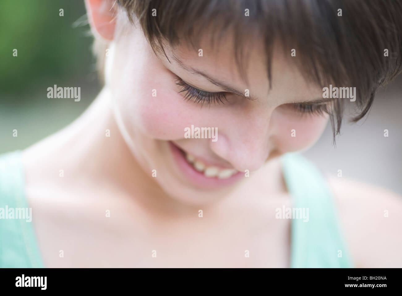 Teenage girl blushes and laughs Stock Photo - Alamy