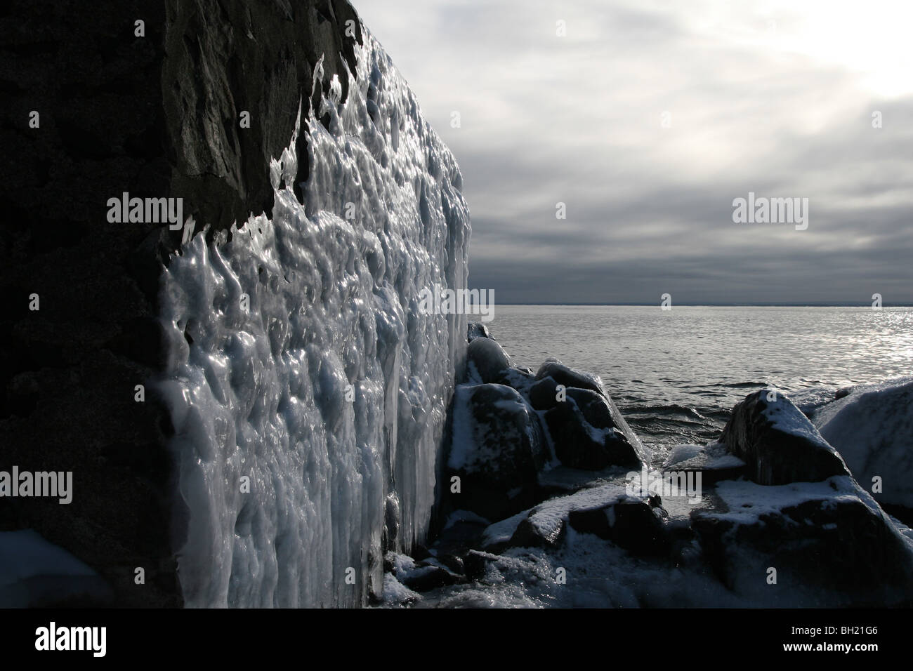 An icy rock wall on the shore of Lake Superior in Duluth, Minnesota ...