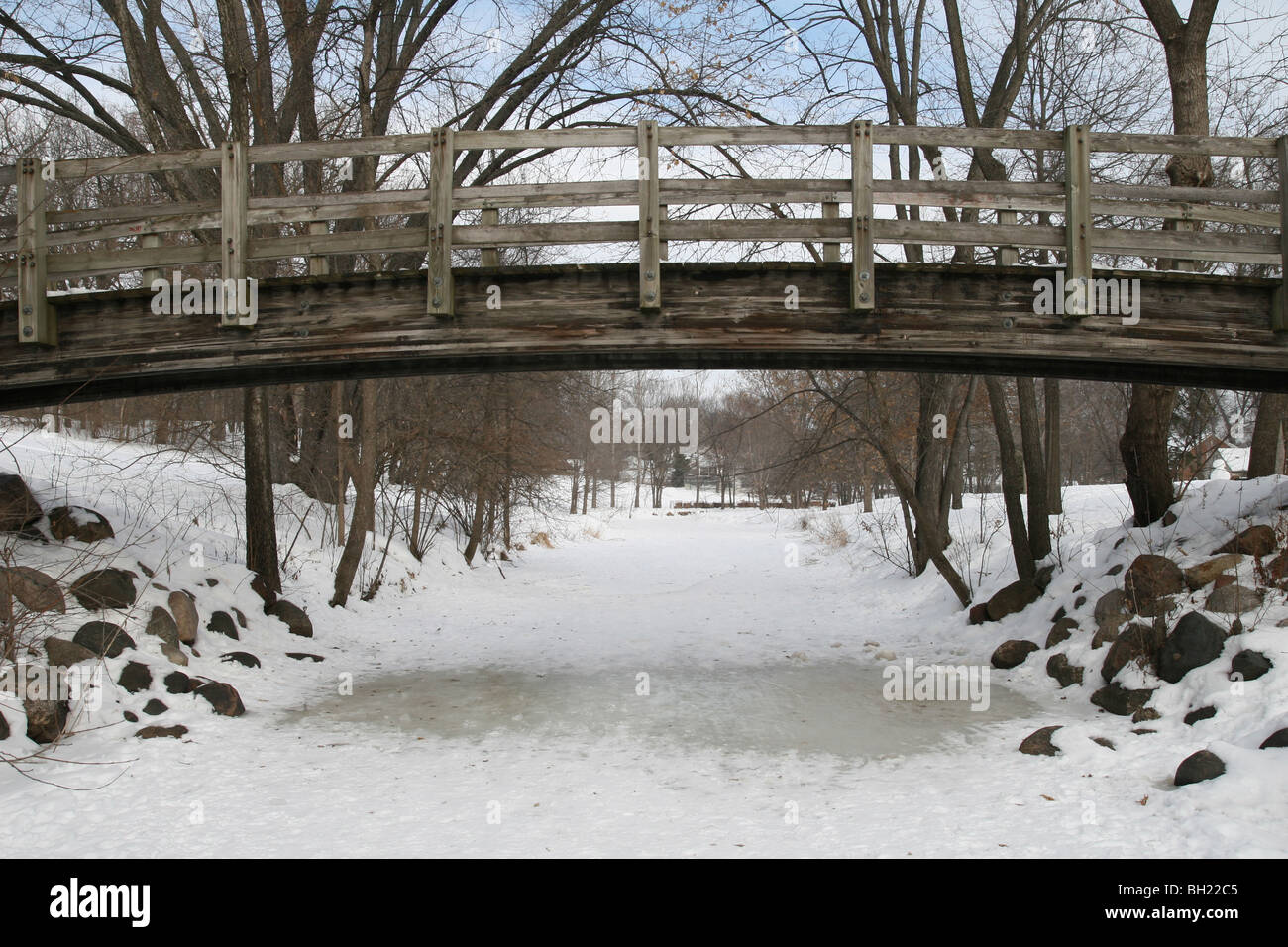 A foot bridge over frozen Minnehaha Creek in Minneapolis, Minnesota ...
