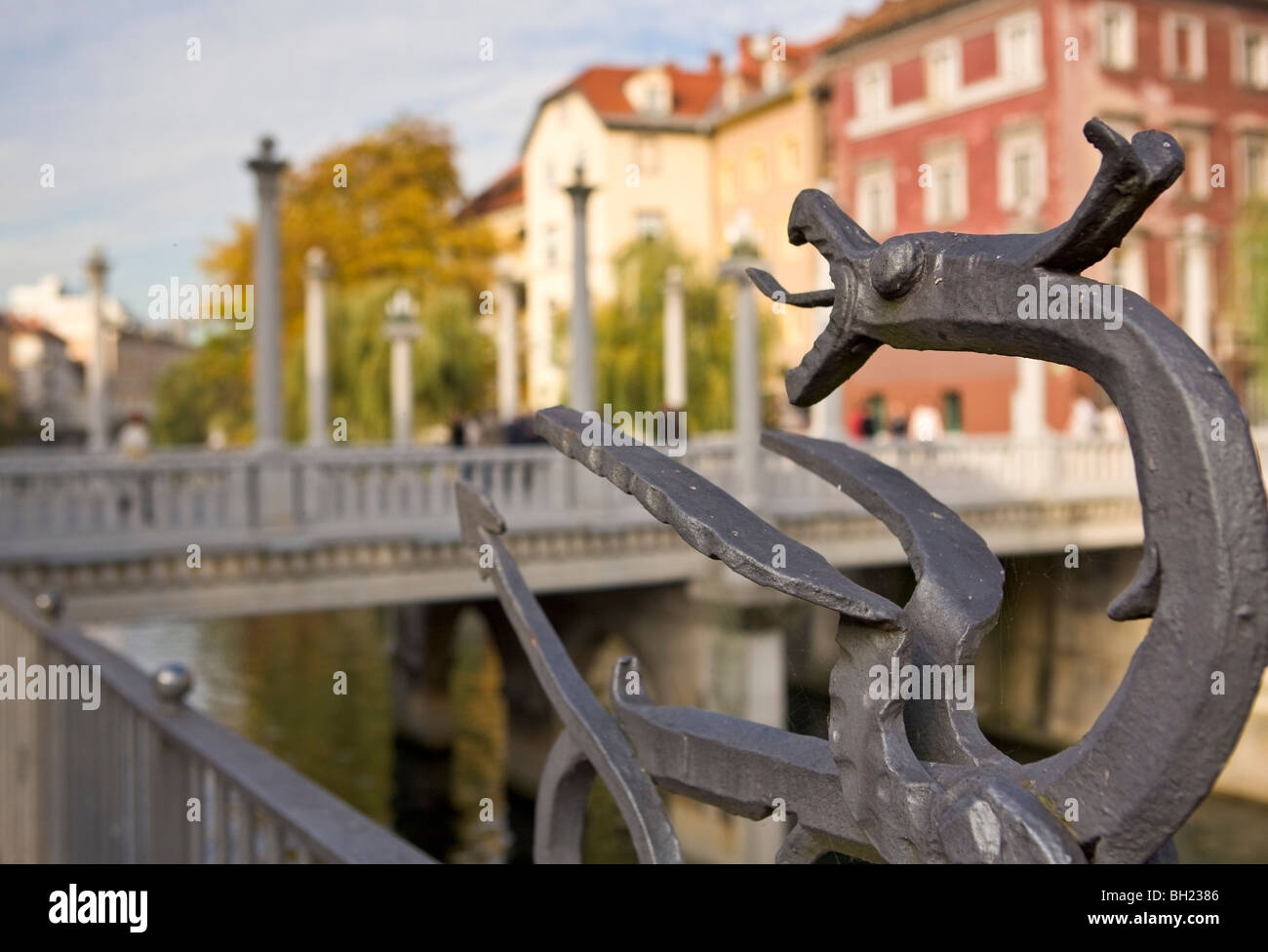 A metal statue on a bridge railing Stock Photo - Alamy