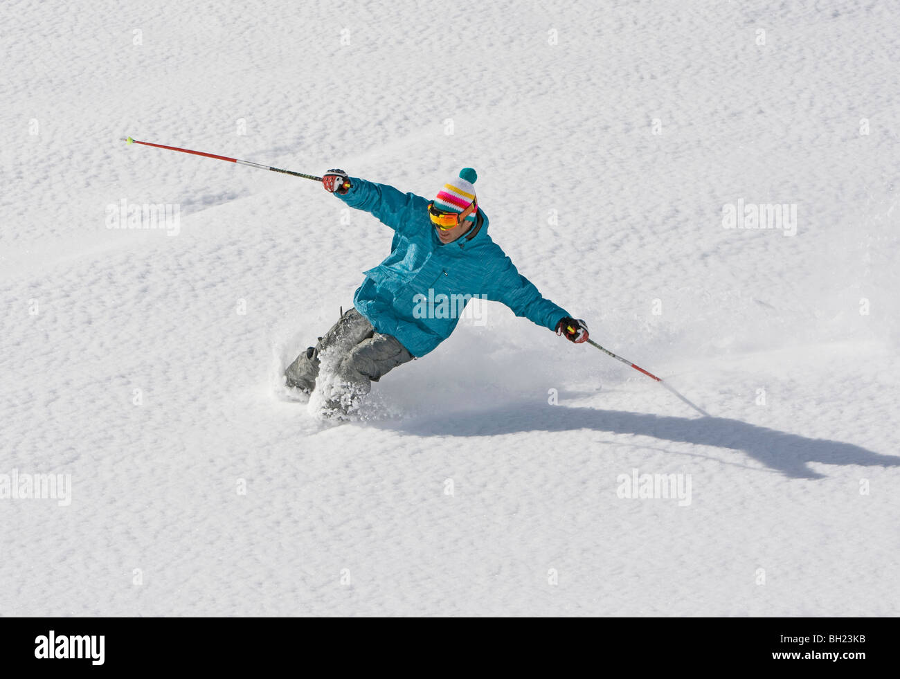 Professional male skier jumps into powder snow, off-piste Val d'Isere ...