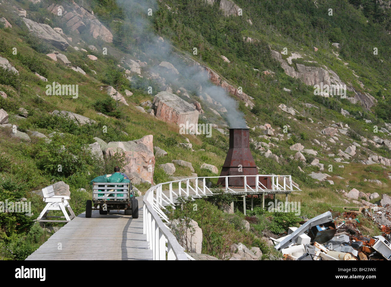 Trash is burned outside the outport village of Francois, Newfoundland ...