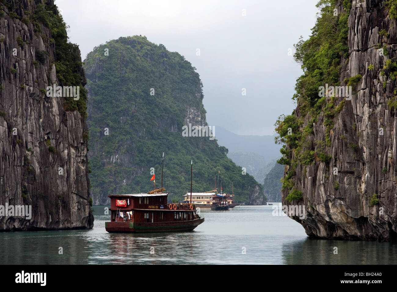 Two boats going through cliffside waters Stock Photo - Alamy