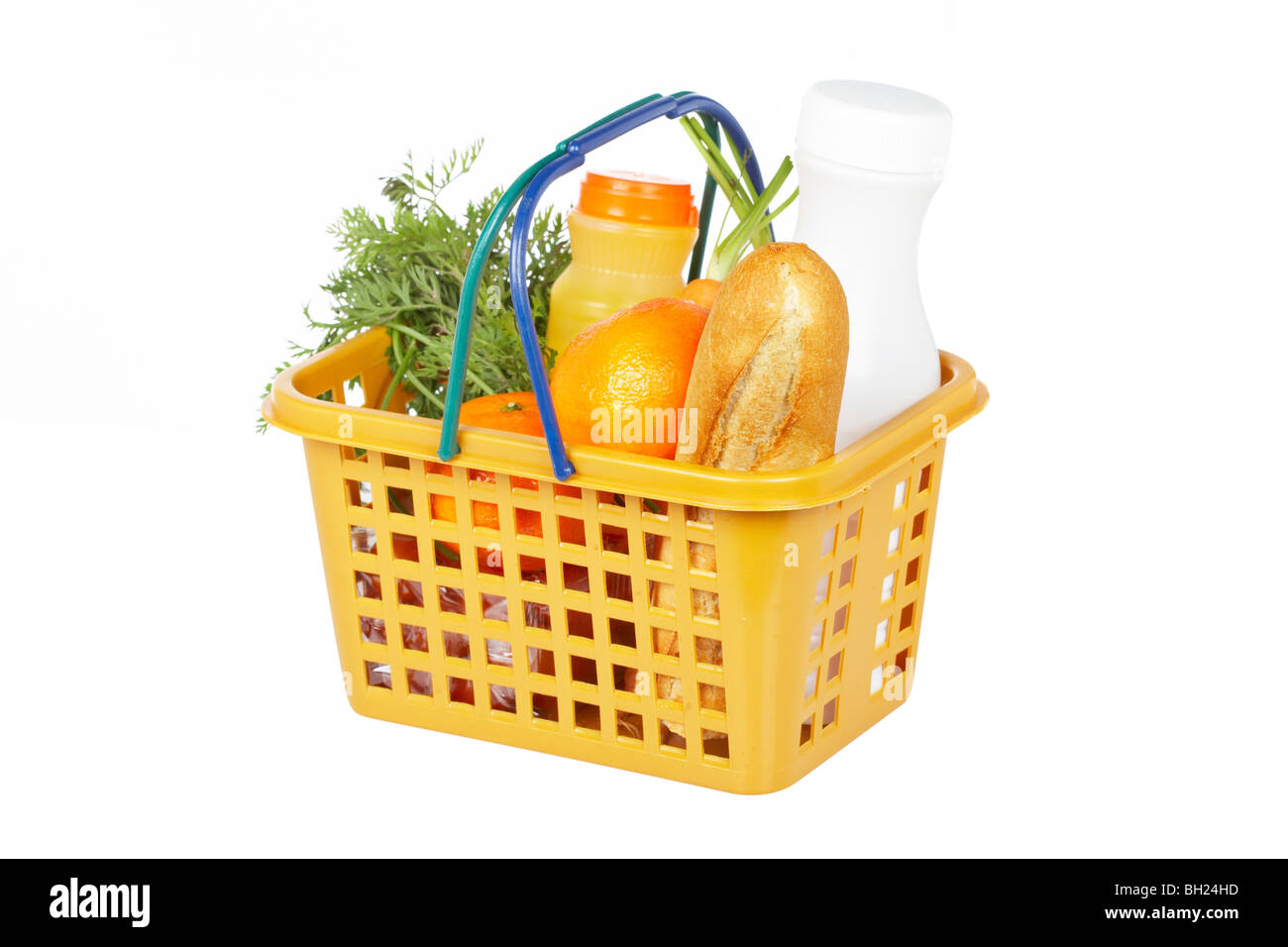 A shopping basket full of groceries isolated on white background ...