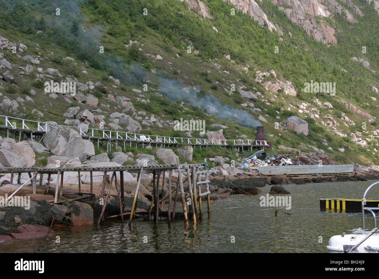 Trash is burned outside the outport village of Francois, Newfoundland ...