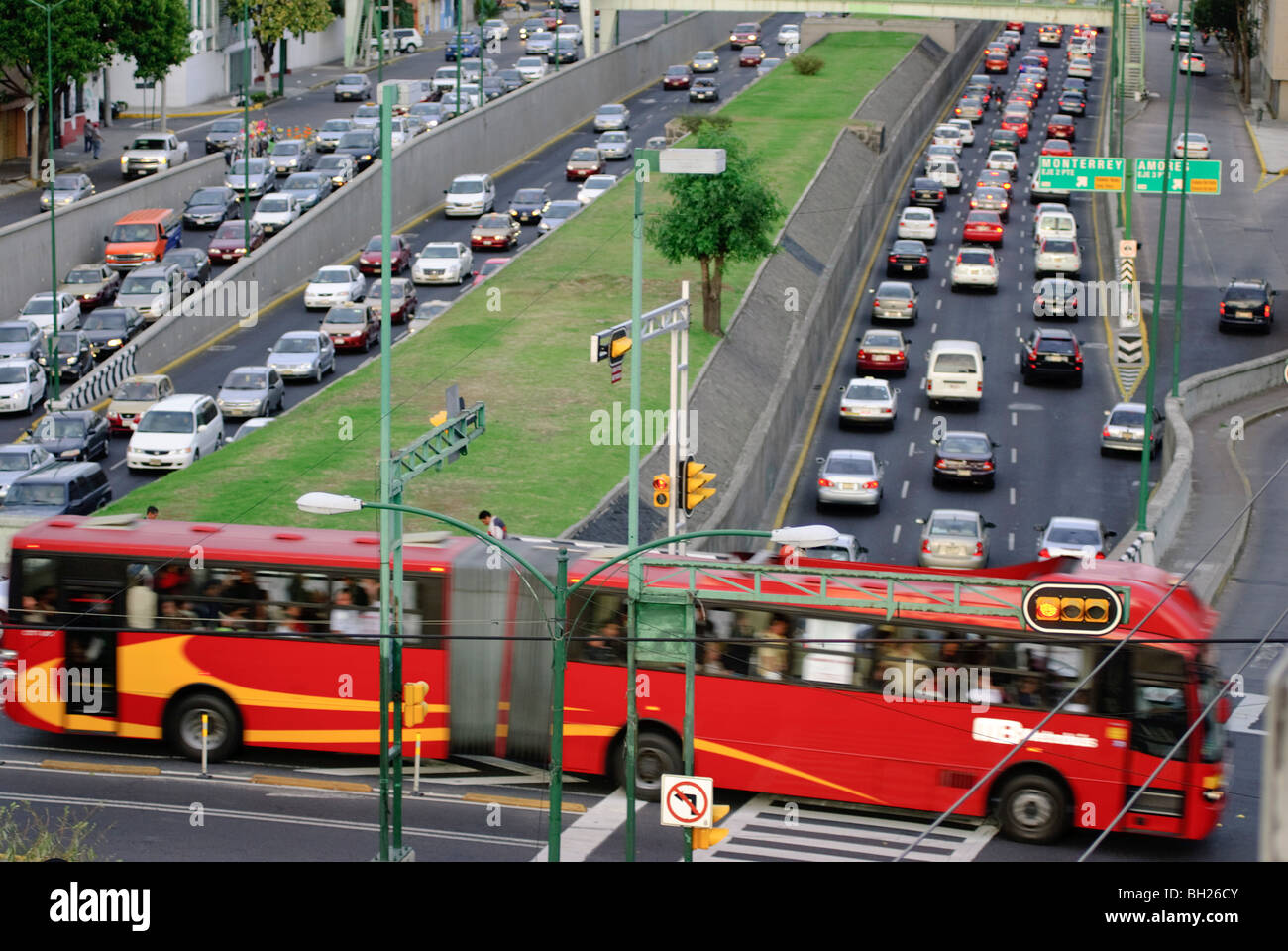 The Metrobús, a BRT (Bus Rapid Transit) crosses an overpass during late ...