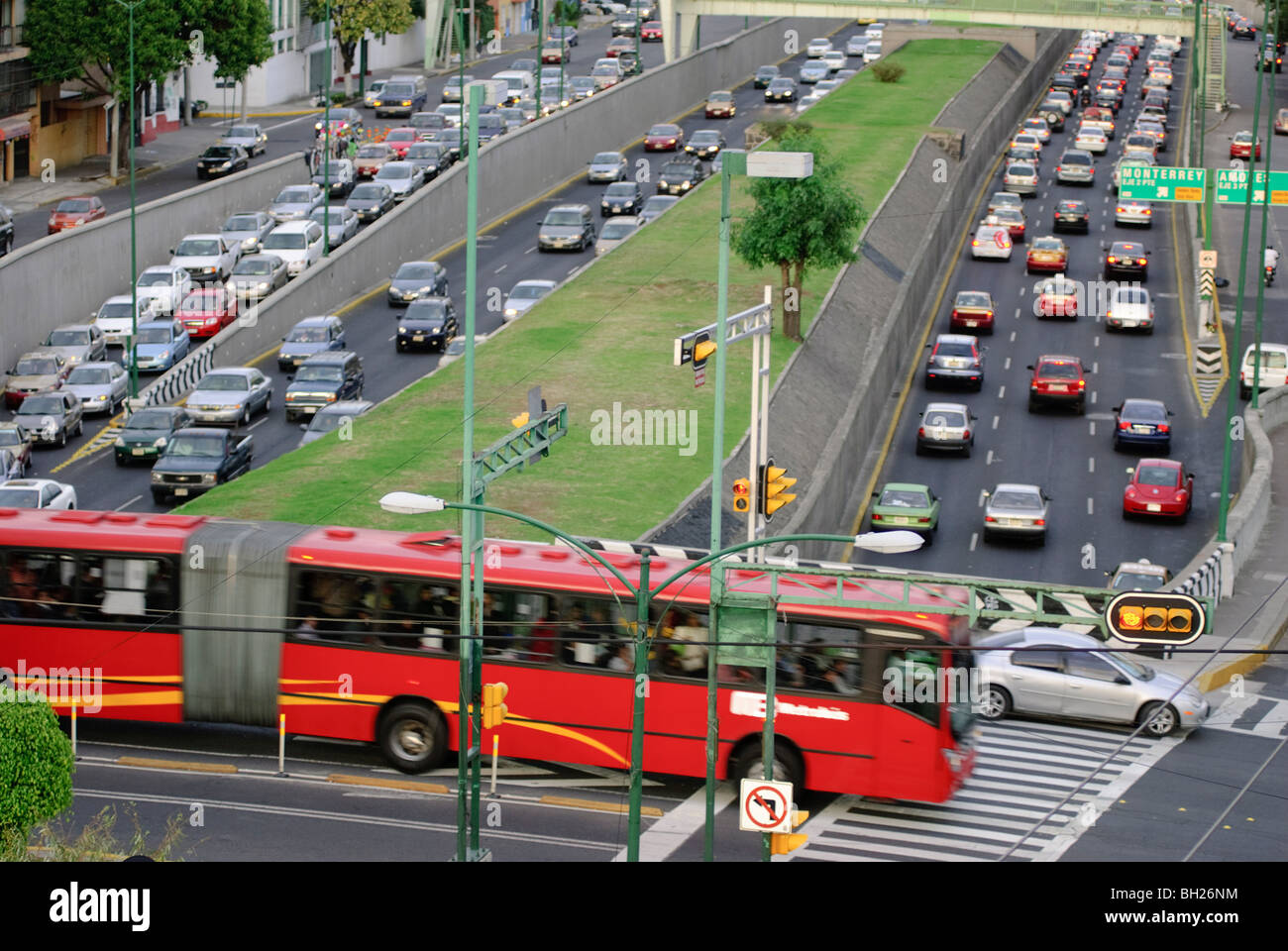 The Metrobús, a BRT (Bus Rapid Transit) crosses an overpass during late ...