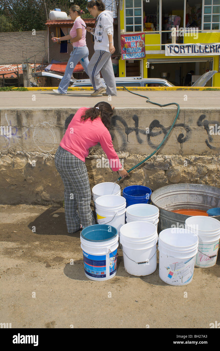 At the makeshift, streetside facility, people of all ages pitch in to ...