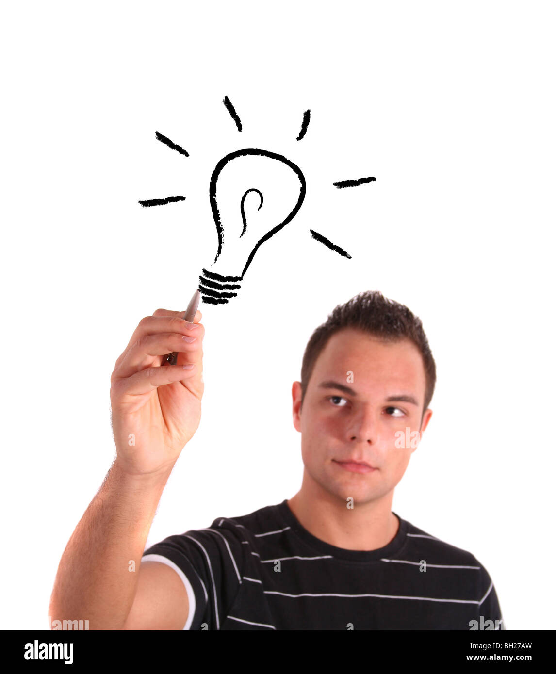 A handsome young man sketching a stylized light bulb. All on white ...