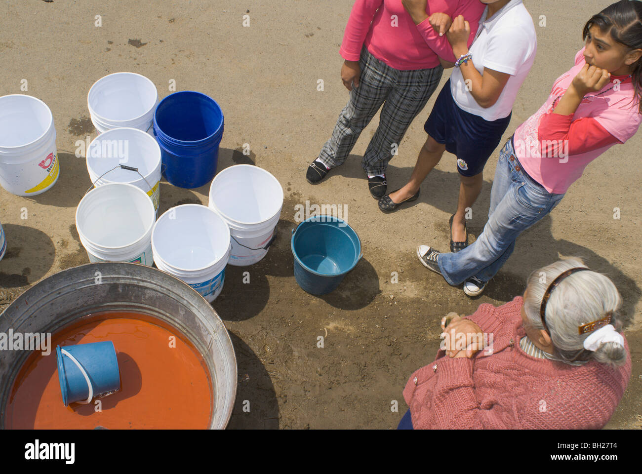 A hose attached to a free-flowing spring provides the barrio of San ...