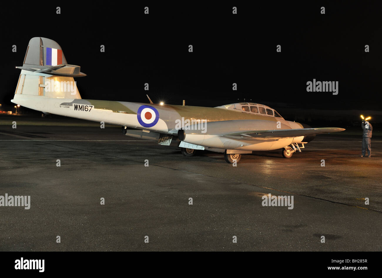 Vintage RAF Meteor two seat jet training aircraft taxying in the dark ...