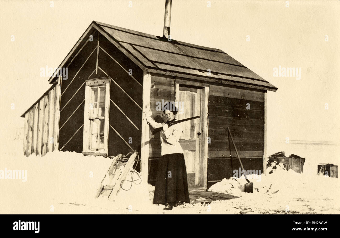 Armed Woman Homeowner & Tarpaper Shack Stock Photo - Alamy