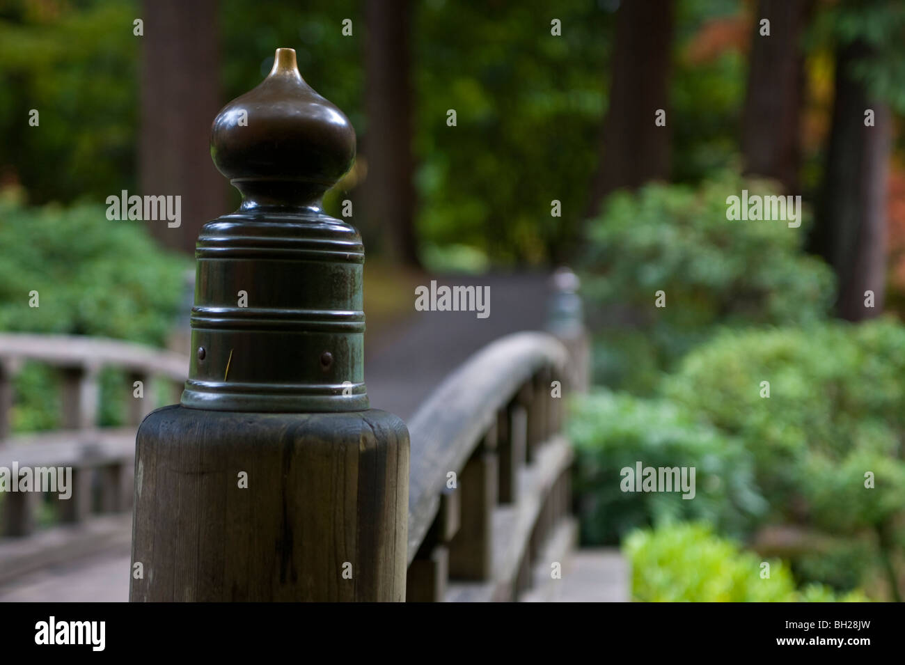 Crown ornament on newel post of railing of bridge in Japanese garden ...
