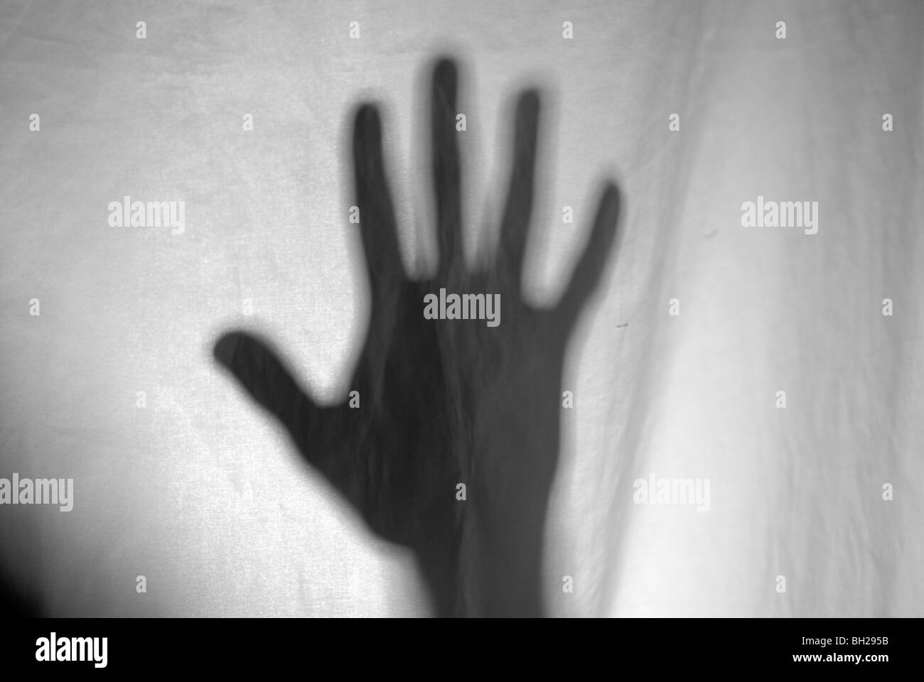 HAND BEHIND THIN FABRIC Stock Photo - Alamy