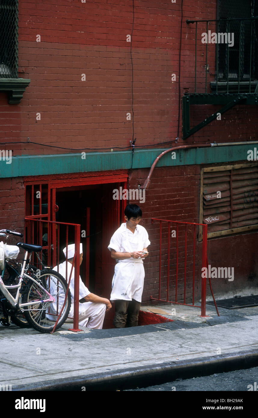 Two chefs outside kitchen on break Stock Photo - Alamy