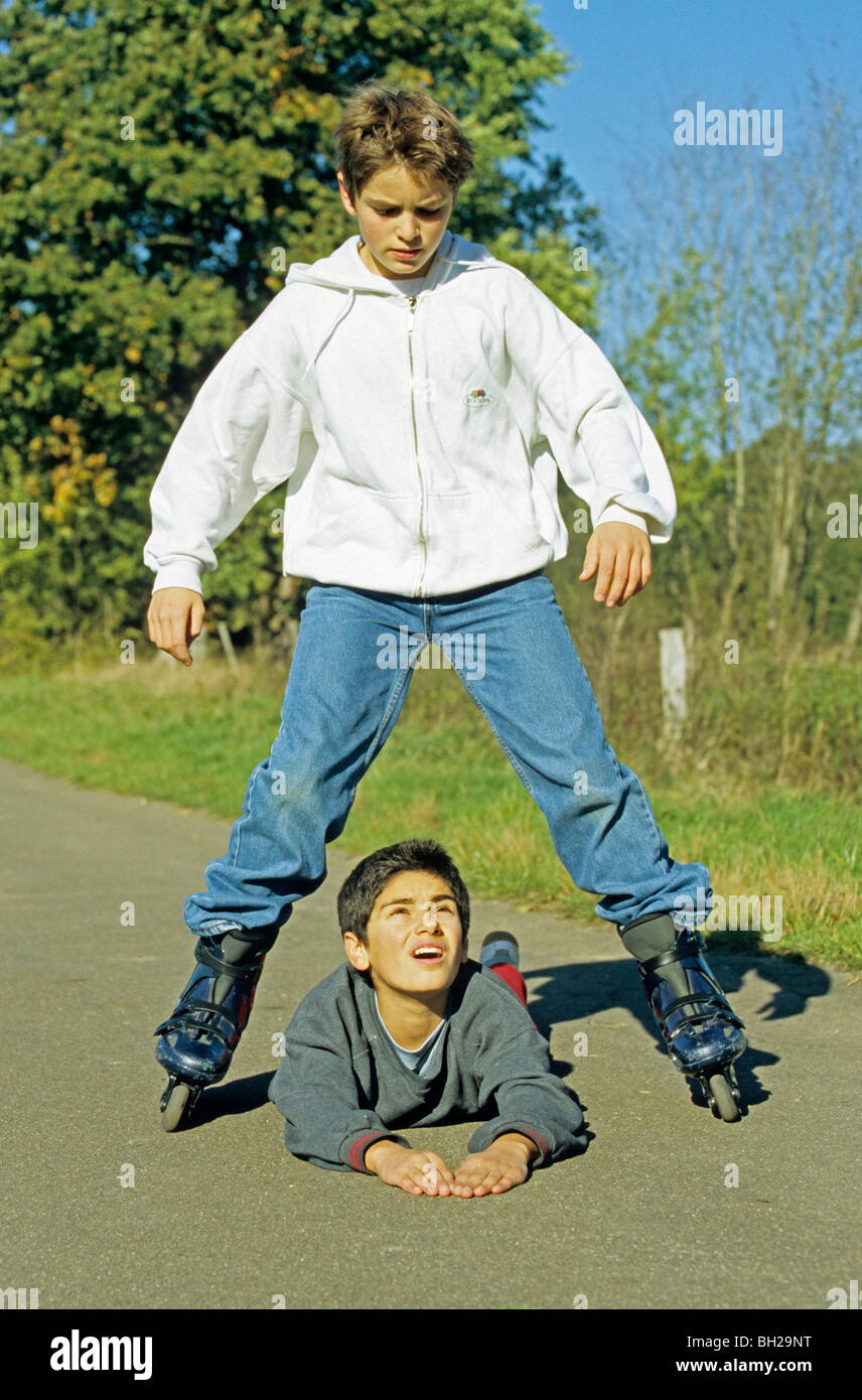 young boys inline skating Stock Photo - Alamy