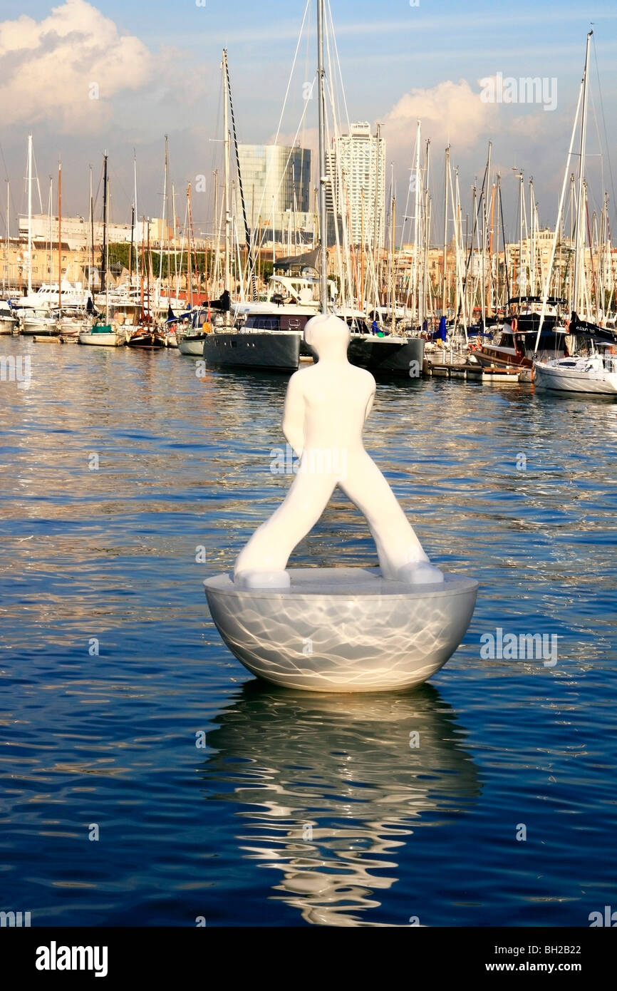 White statue floating near busy marina Stock Photo - Alamy