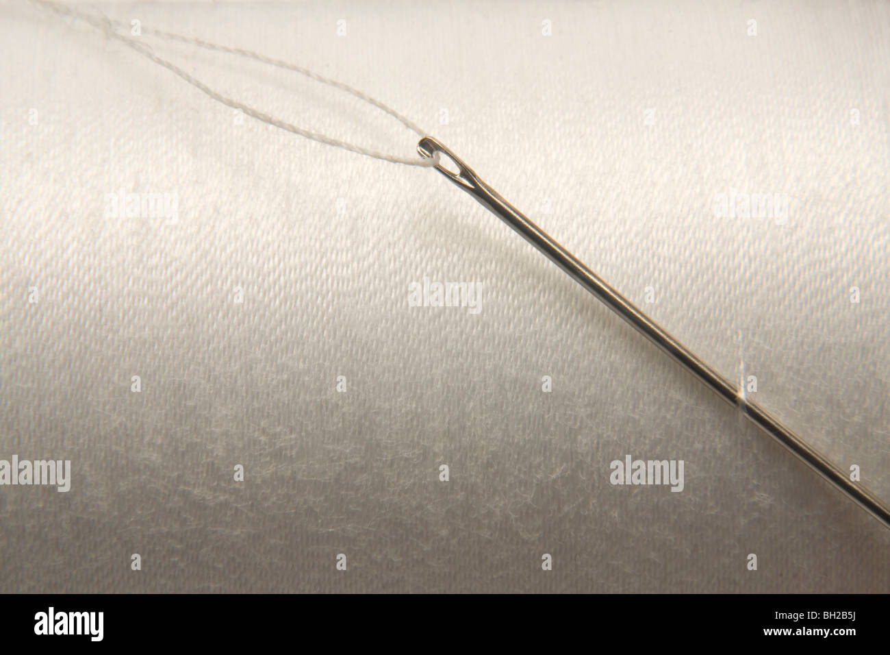 Threading needle thread hi-res stock photography and images - Alamy
