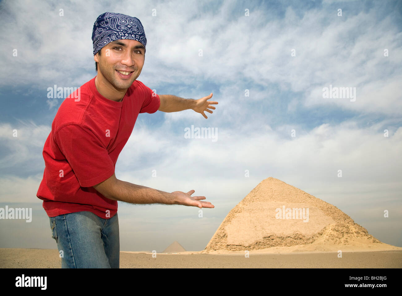 Man showing off Pyramid in background Stock Photo - Alamy