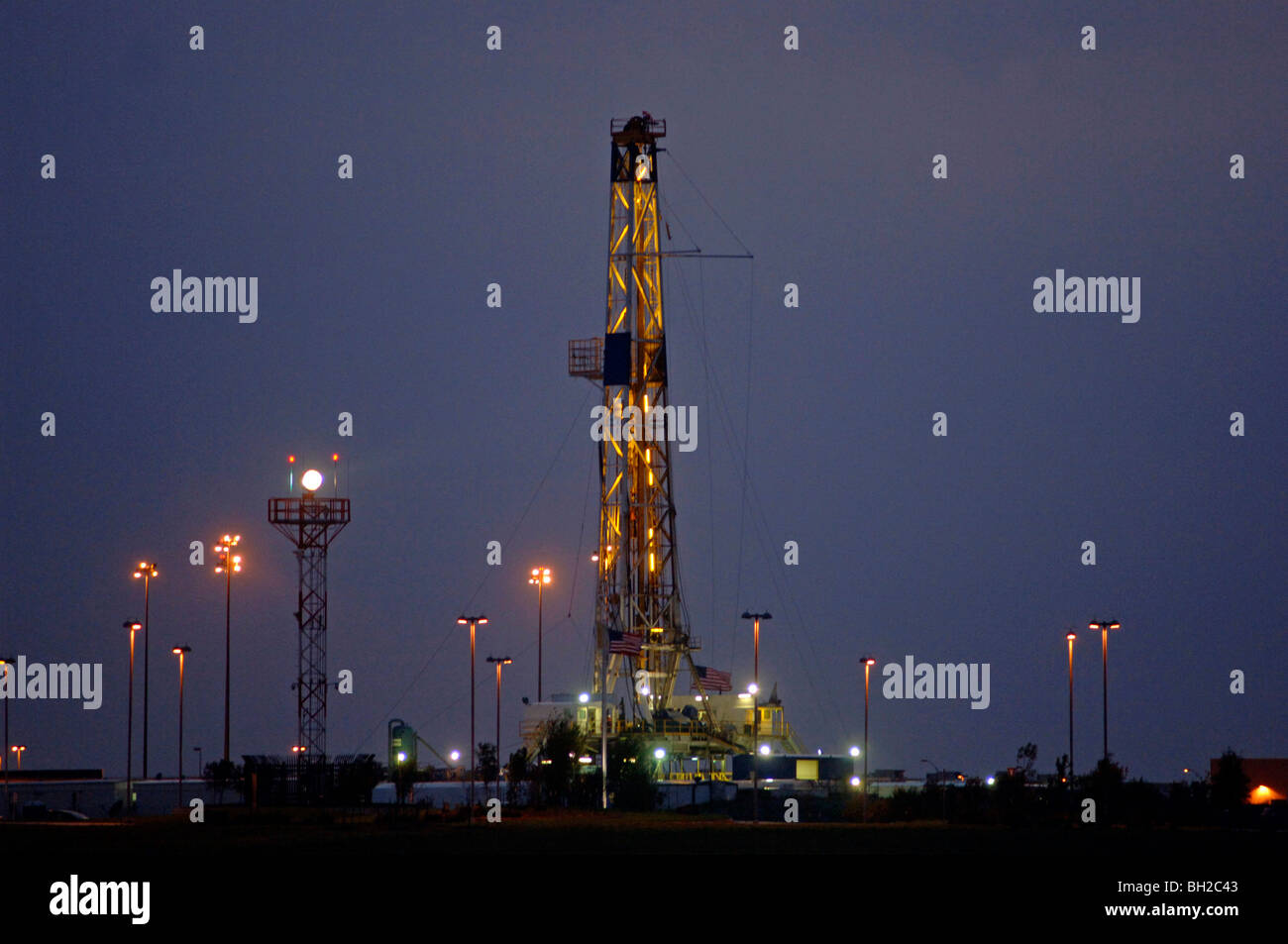 Petroleum drilling rig on public property towers above the surrounding ...