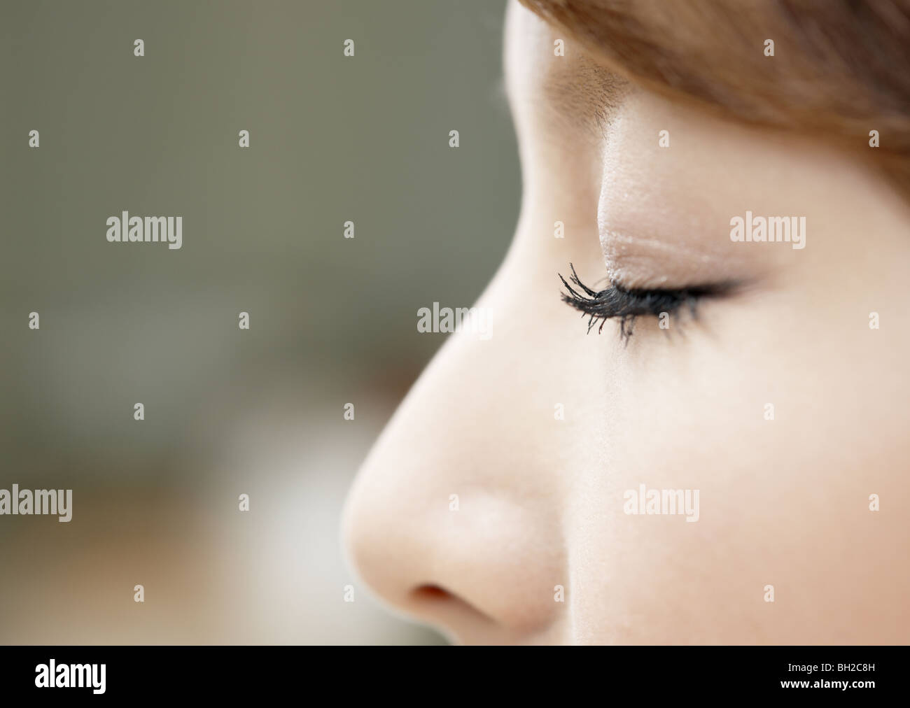 A young woman closing her eye Stock Photo - Alamy